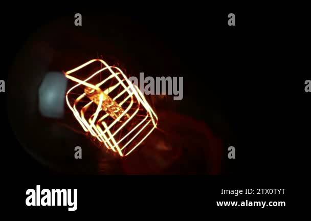 turn on and turn off, close-up of retro vintage light bulb with ...