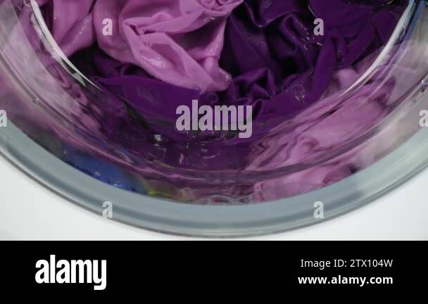 Extreme Close Washing Machine Door View with Wet Clothes and Water ...