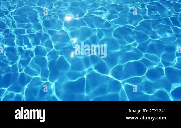 Cheery wading pool water sparkling with its playingblue waves in slo-mo ...