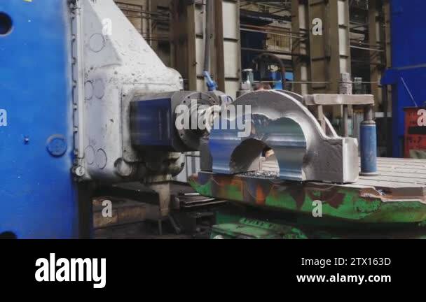 Milling machine cutting the sample part. Turning lathe in action.Facing ...