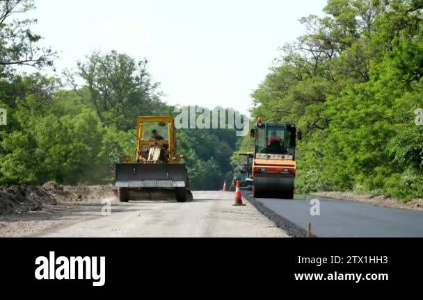 repair of a highway, roller compactor machine and asphalt finisher ...