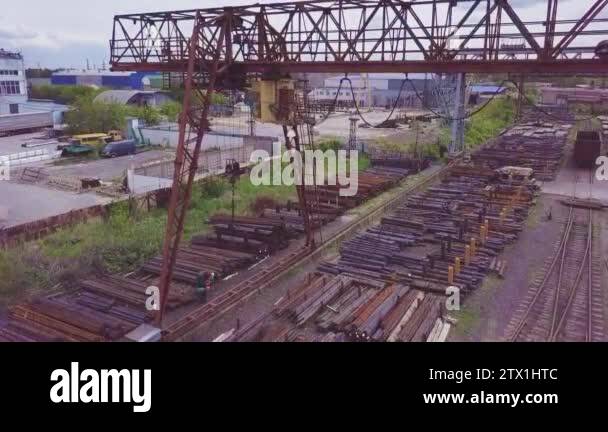 A gantry crane is moving over a metal warehouse. the camera monitors ...