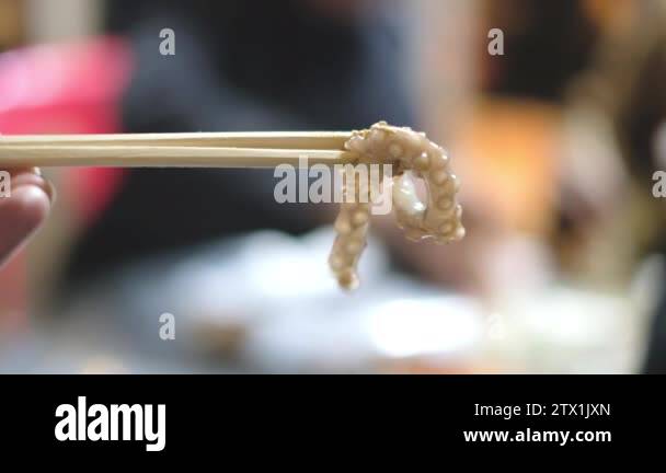 hopsticks tong octopus tentacle. Famous korean food Stock Video Footage ...