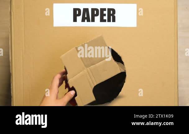 People throwing crumbled waste into paper container, sorting and ...