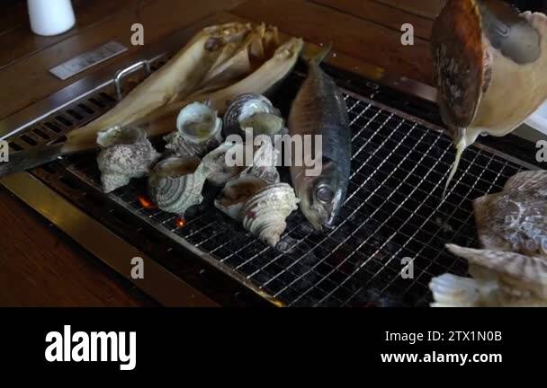 Various kind of grilled sea shells scallop(Hotate), horned turban sea ...