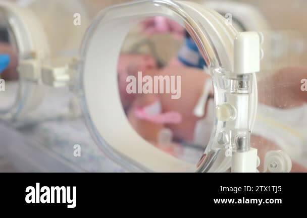 Neonatology concept, Newborn baby Cared for by doctor neonatologist and ...