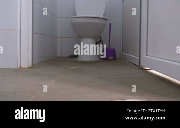 Public toilet cubicles. The camera moves smoothly from below between ...