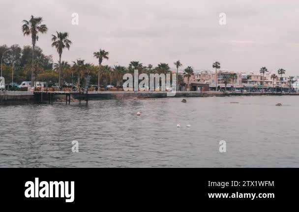 Beautiful view of lively tourist promenade from sea. Beach promenade ...