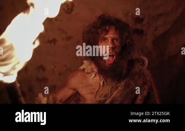 Portrait of Primeval Caveman Wearing Animal Skin Standing in His Cave ...