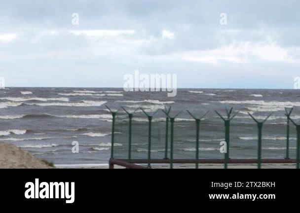 Foamy waves during a storm. Rainy day. Video. Storm on the sea. The ...