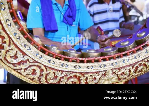 Thai classical music instrument : Hands hitting the Thai wooden alto ...