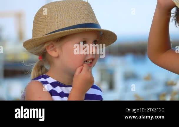 Boy and girl change their hats and laugh Stock Video Footage - Alamy