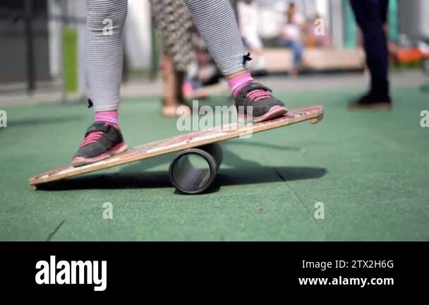 life in a modern city - a girl rides a balance-board on an advanced ...