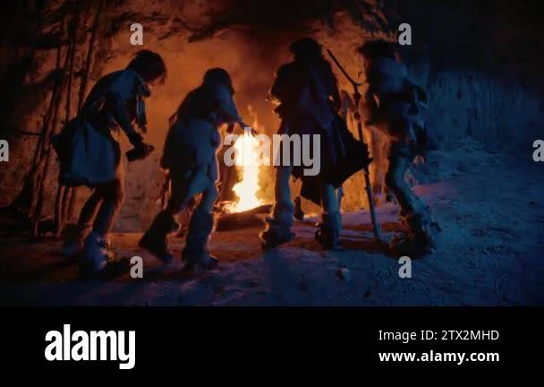 Tribe of Prehistoric Hunter-Gatherers Wearing Animal Skins Dance Around ...