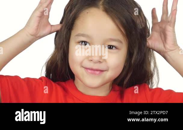 Close-up happy little girl have fun and act the ape. Slow motion Stock ...