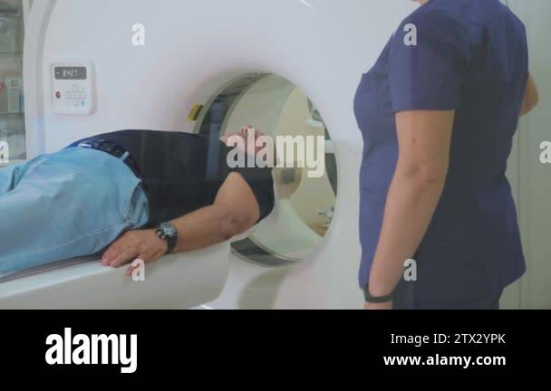 Elderly patient is scanned by MRI, CT scanner at modern hospital Stock ...