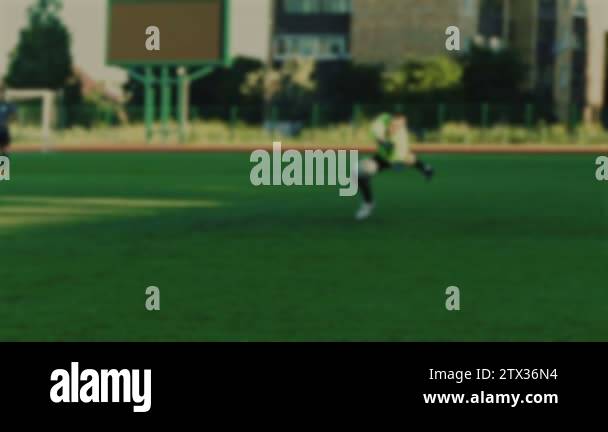 Goalkeeper not save a ball and misses goal, soccer player hits the ball ...