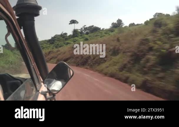 CLOSE UP: All terrain safari jeep driving on dusty road through ...