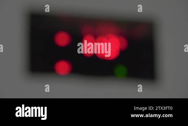 Flashing digital temperature and humidity indicator. Blurred image ...