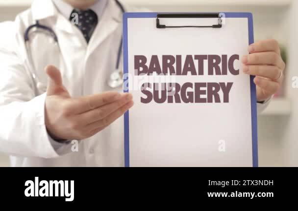 Doctor wearing a stethoscope pointing to a clipboard with BARIATRIC ...