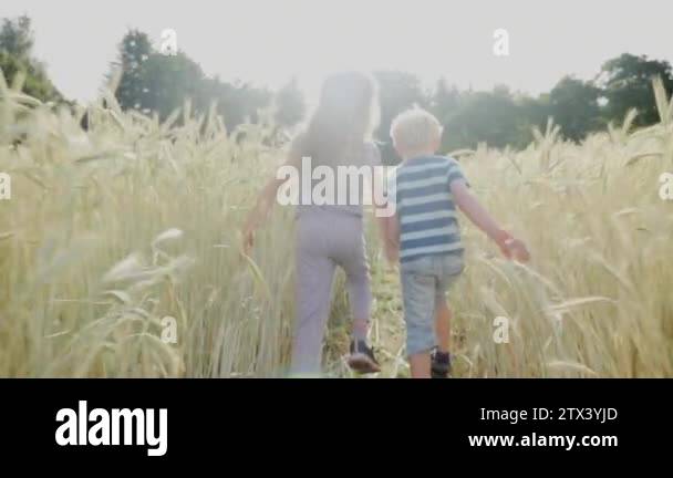 Brother and sister running Stock Video Footage - Alamy