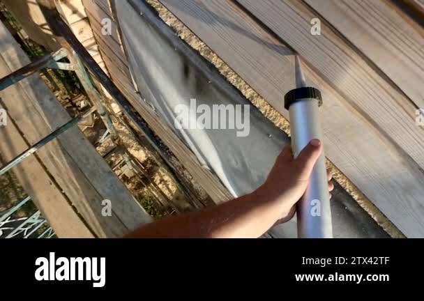 Sealing joints and cracks silicone sealant and insulation, insulation, painting a wooden house ...