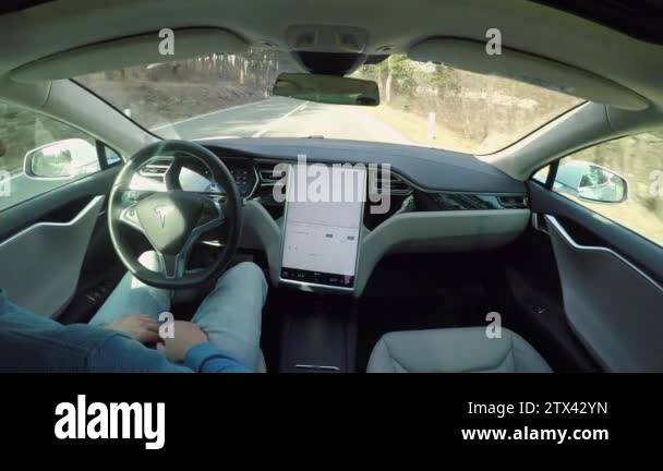 Autonomous car - FEBRUARY 1st 2017: Male driver sitting behind the ...