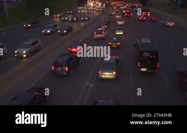 CLOSE UP, TIMELAPSE, HIGH ANGLE: Vehicles driving along on-ramp ...