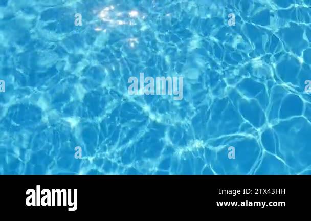 Brilliant swimming pool shimmering with its bright crystalline sky blue ...