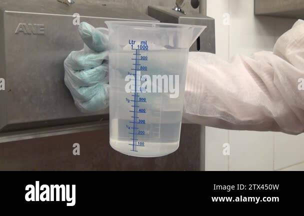 Measure the vessel 1 liter with water Stock Video Footage - Alamy