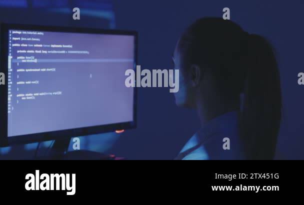 Experienced IT woman programmer works on a new program. Young woman ...