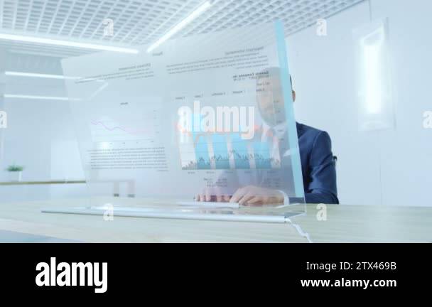 In the Near Future Successful Businessman Works on Computer with ...