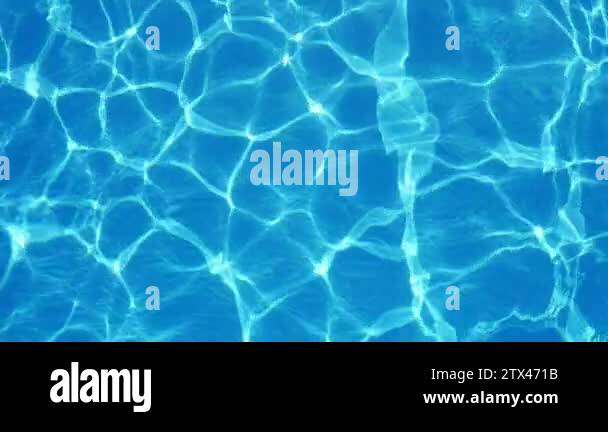 Arty looking paddling pool water sparkli with its rippling turquoise ...