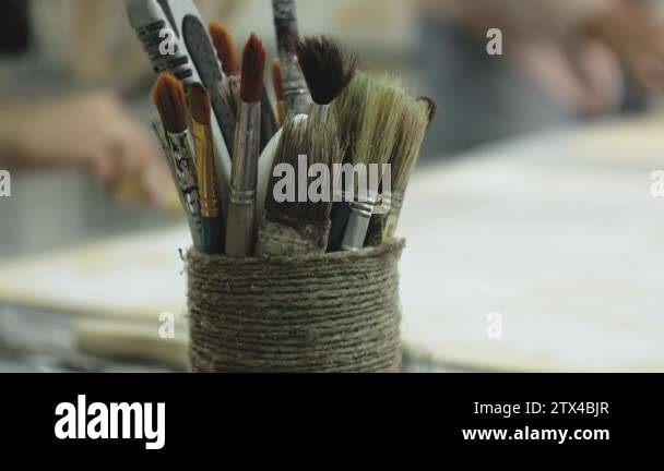 Masters in the art studio process the wood with paint and putty ...