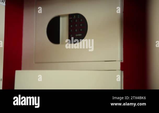 Forward panel of the safe. Sections with the coded lock and a key ...