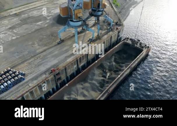 Process of unloading a barge with rubble with two cranes Stock Video ...