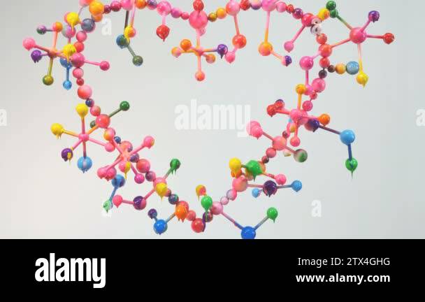close up color of atom in heart shape are dripping. construction of ...