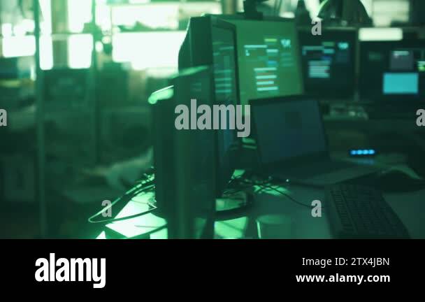 Developer and hacker hidden workstation: multiple screens and connected computers on a desktop ...