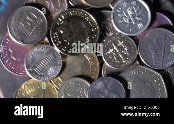 Coins of different countries on a gas burner. Symbol of increasing fuel ...