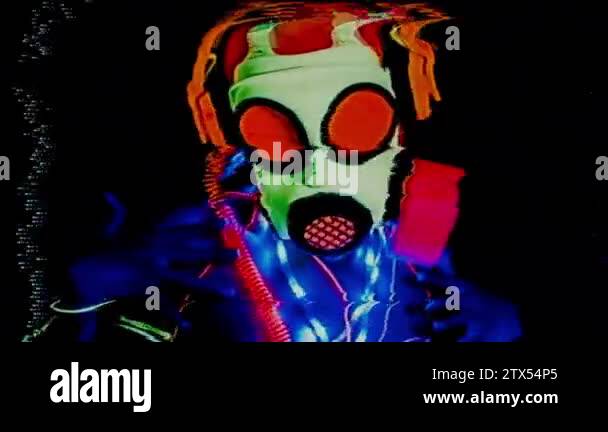 Female wearing in fluorescent gas mask dancing with glitch effect Stock ...