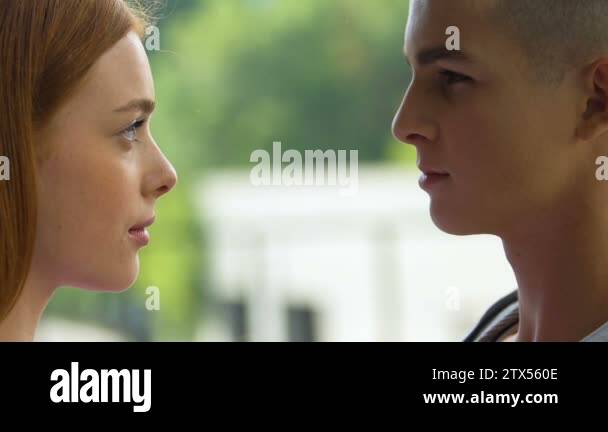 Young teenage couple touching foreheads, first love and tender feelings ...
