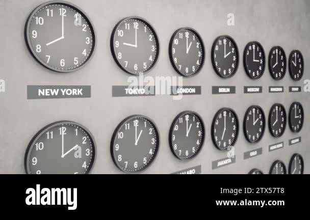 Round clocks show time in different cities on white dark concrete wall ...