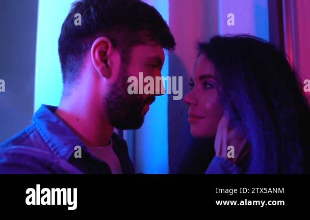 Romantic couple kissing in night illumination, love feelings, feeling ...