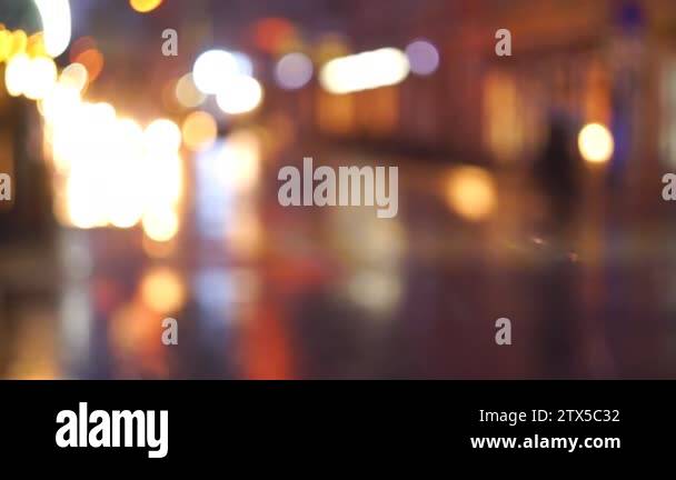 Lights of the night city. Rain, the movement of astomobiles and ...