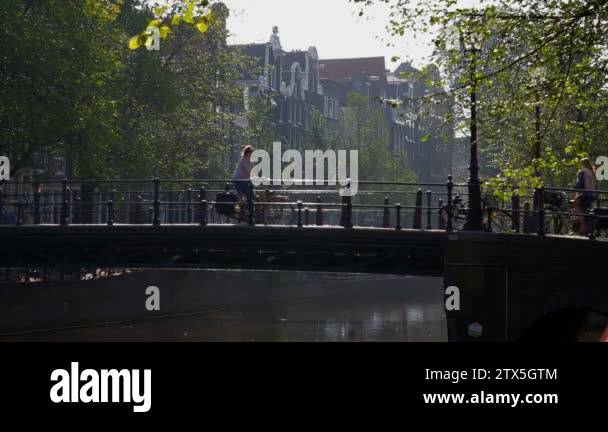 Amsterdam with its traditional Canal system and many bridges used by ...