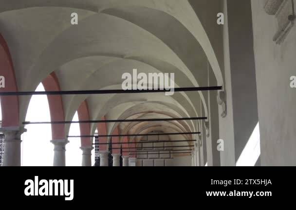 Old arcade, corridor and flowers in the pots. Elements of architecture of buildings, ancient ...