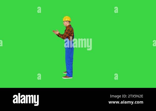 Construction worker making a flip and folds hands looking to camera The ...