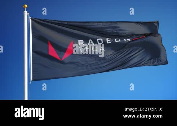 AMD Radeon Vega brand flag waving in slow motion against blue sky ...