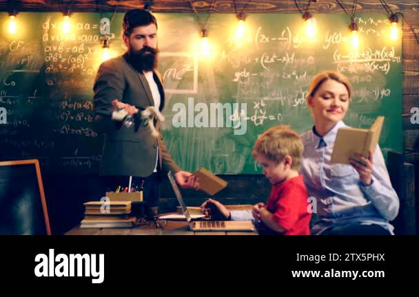 Two teachers are interested in learning a boy. Learning concept. School ...