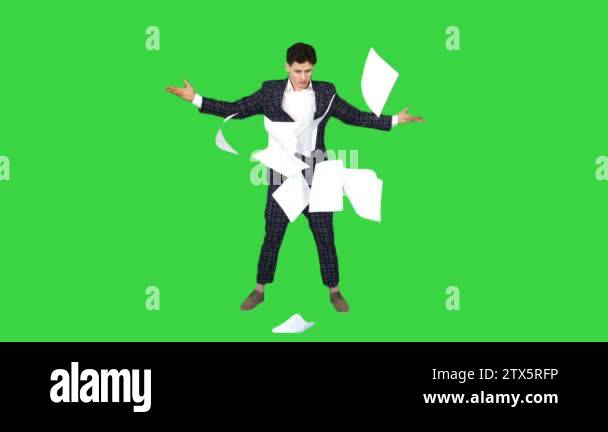 Businessman throwing papers in the air and dancing on a Green Screen ...
